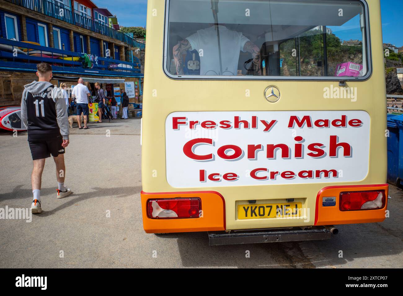 A vehicle truck selling Cornish ice cream parked on Towan beach ...