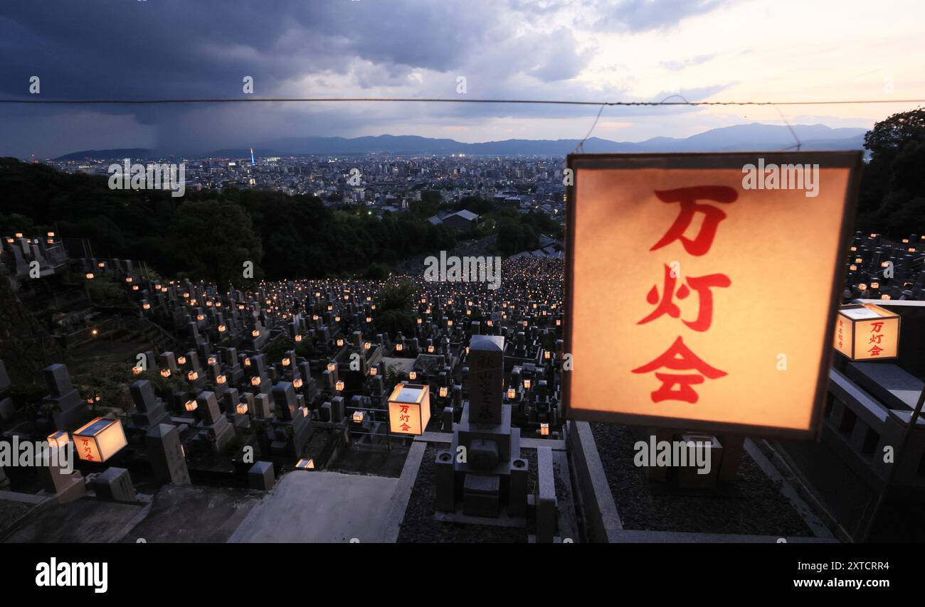 People visit graves during the Mandoue ceremony at Otani Mausoleum of ...