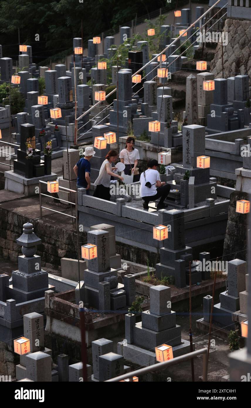 People visit graves during the Mandoue ceremony at Otani Mausoleum of ...