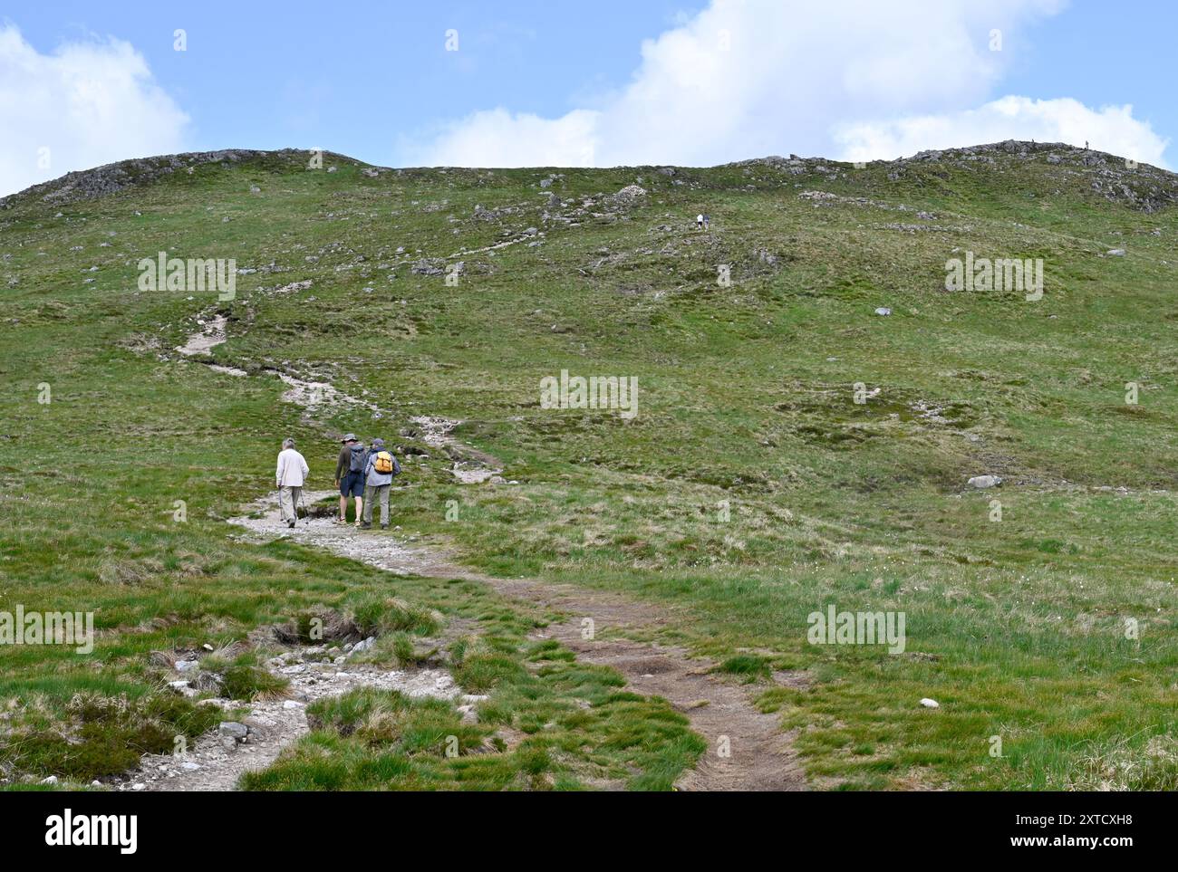Walkers at the top of the Glencoe Ski Lift hiking to the summit Stock ...