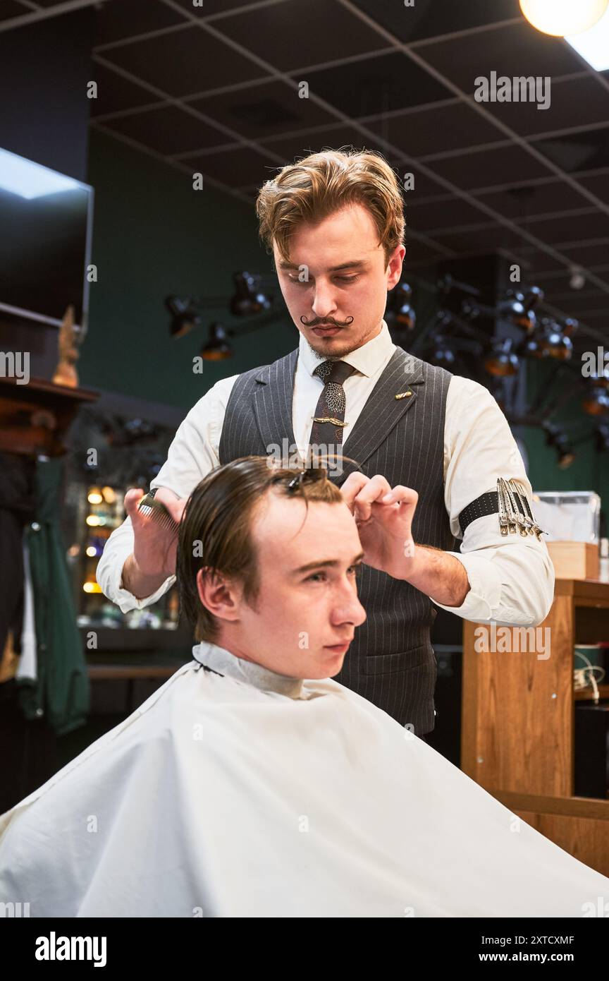 Stylist hairdresser using clipper comb hi-res stock photography and ...
