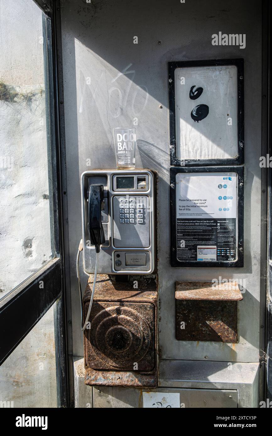 The dirty interior of a public telephone box in the UK Stock Photo - Alamy