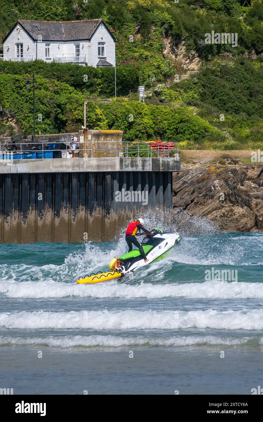 A RNLI Royal National Lifeboat Institution Lifeguard patrolling off ...