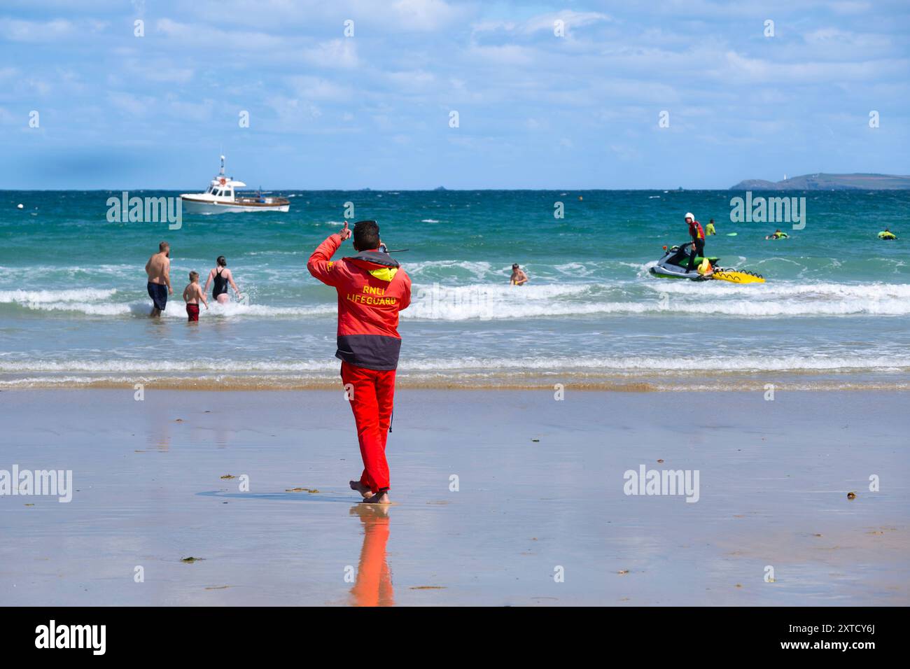 RNLI Royal National Lifeboat Institution Lifeguard s working together ...
