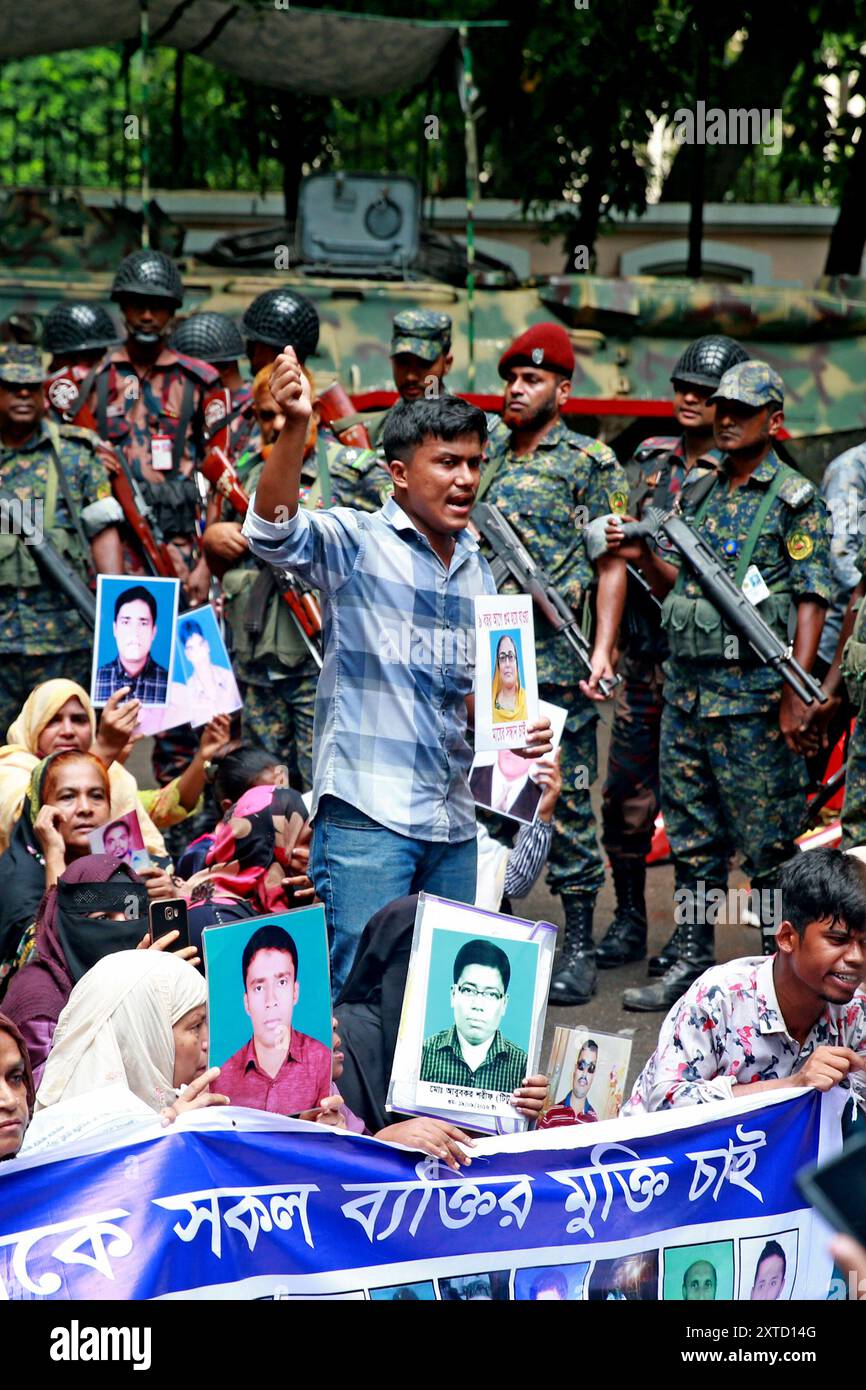 Family members of victims of enforced disappearances holding the ...
