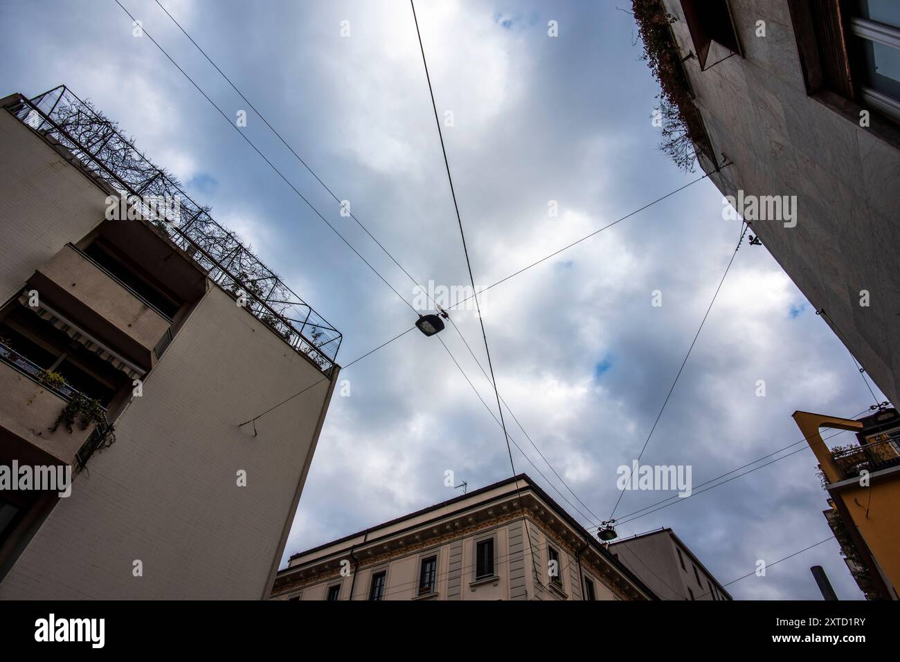 geometries of windows and buildings with sky and electric wires in the ...