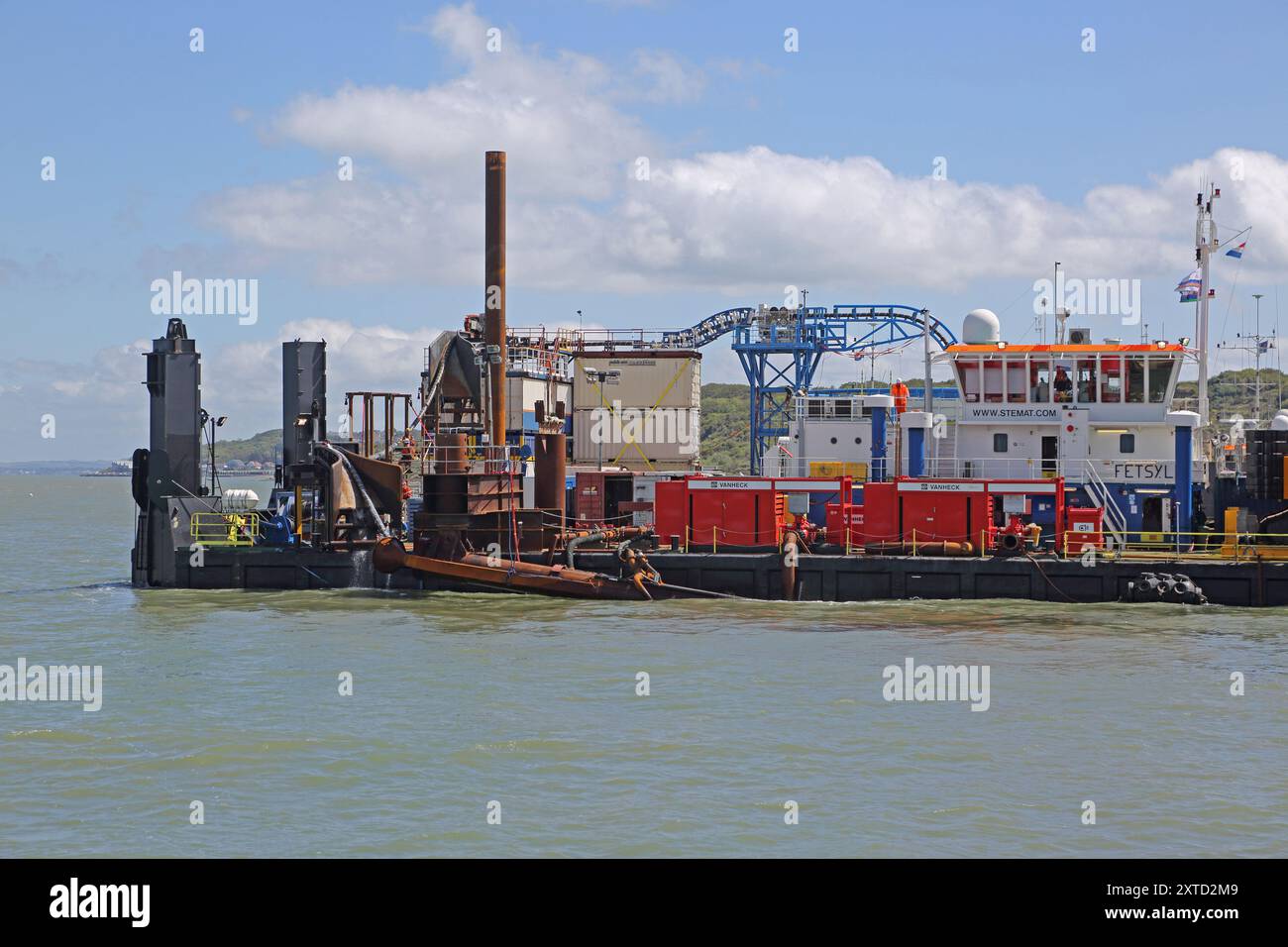 A cable laying barge installing a high voltage, sub-sea cable between ...