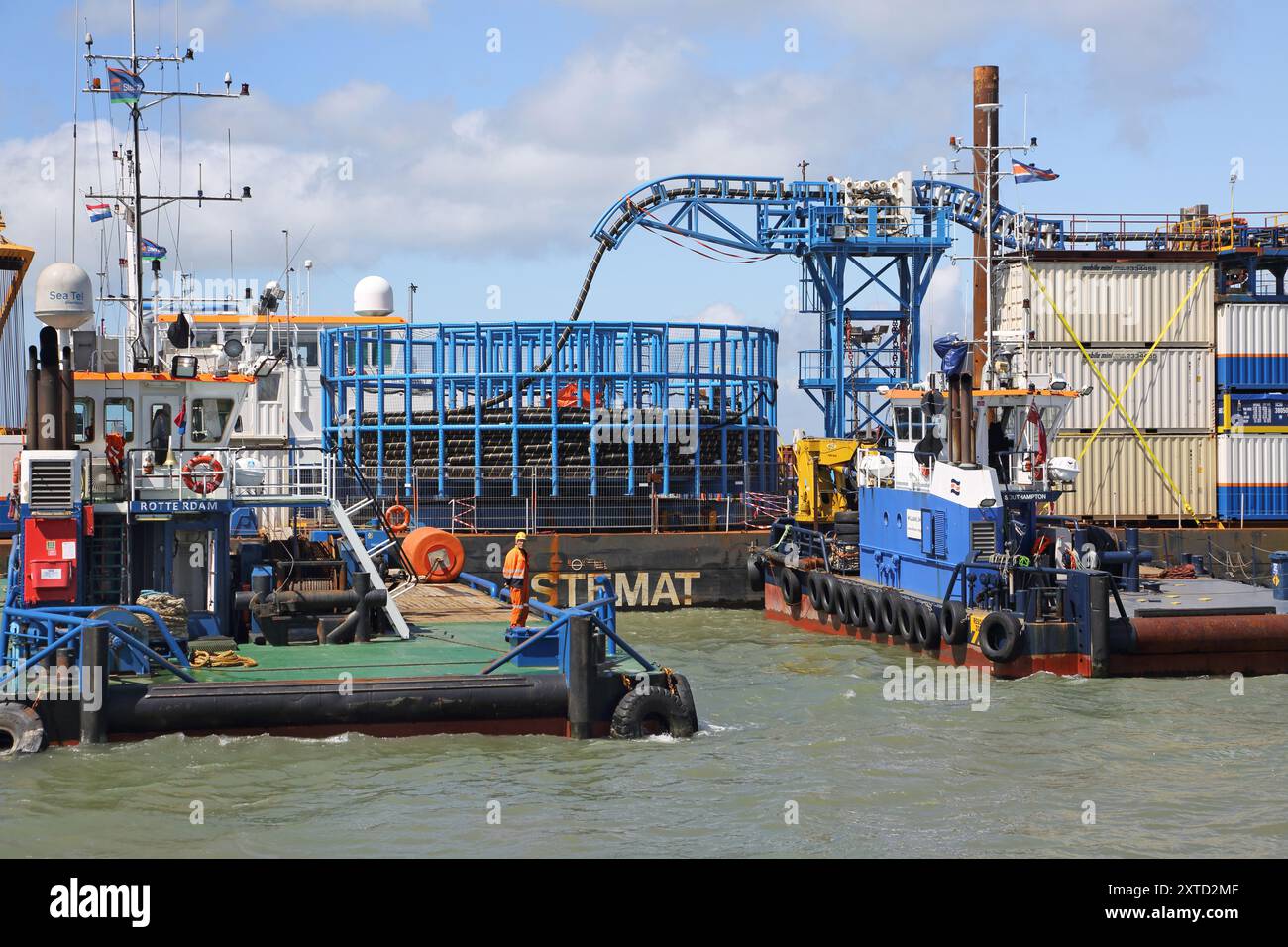 A cable laying barge installing a high voltage, sub-sea cable between ...