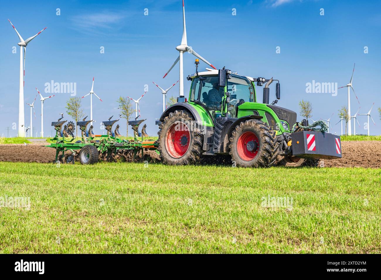 Agricultural technology - Tractor with mounted reversible plough in the ...