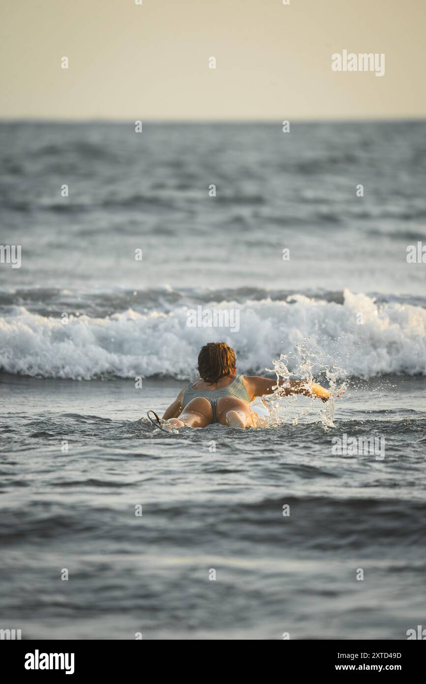Female surfer and ocean wave hi-res stock photography and images - Alamy