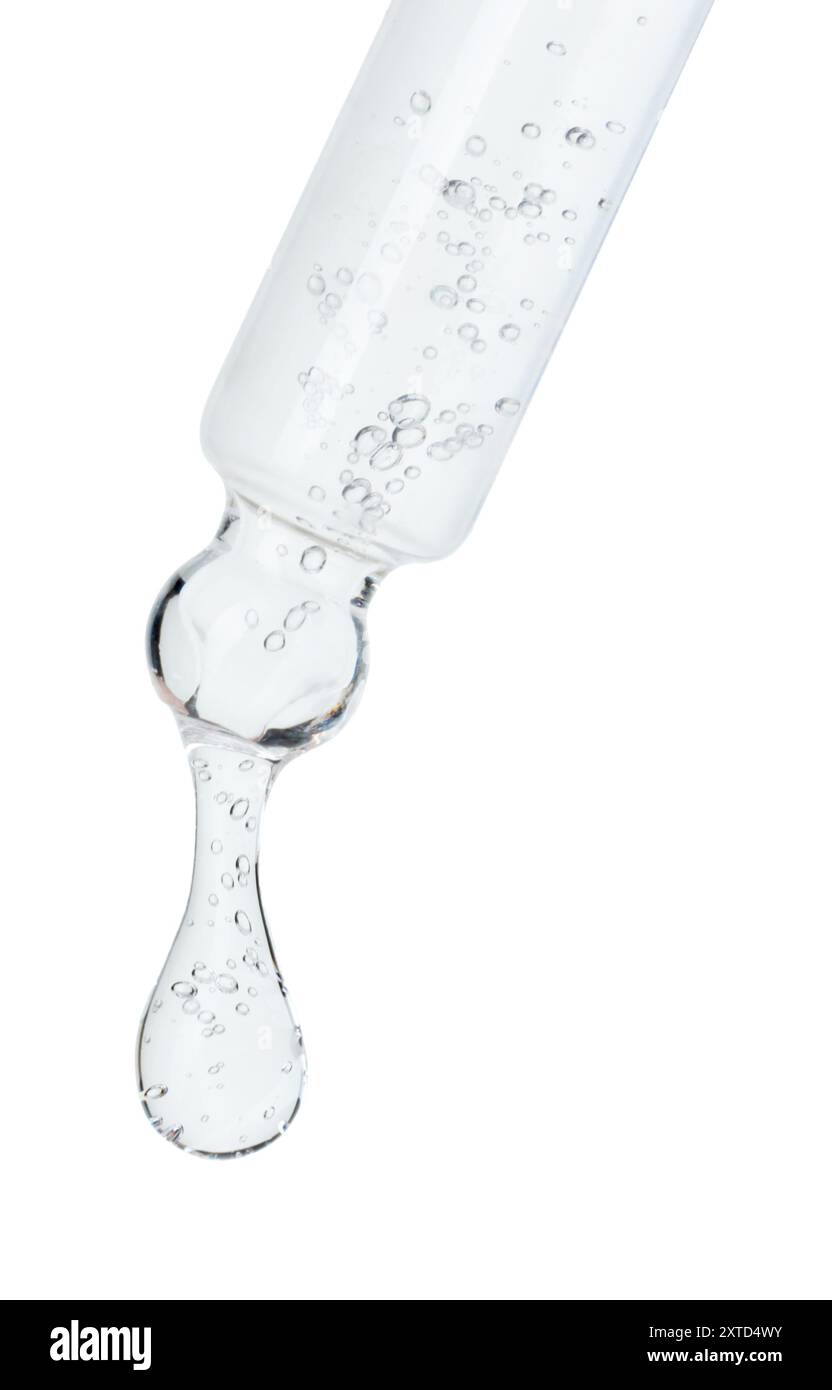 Dripping cosmetic serum from pipette on white background Stock Photo ...