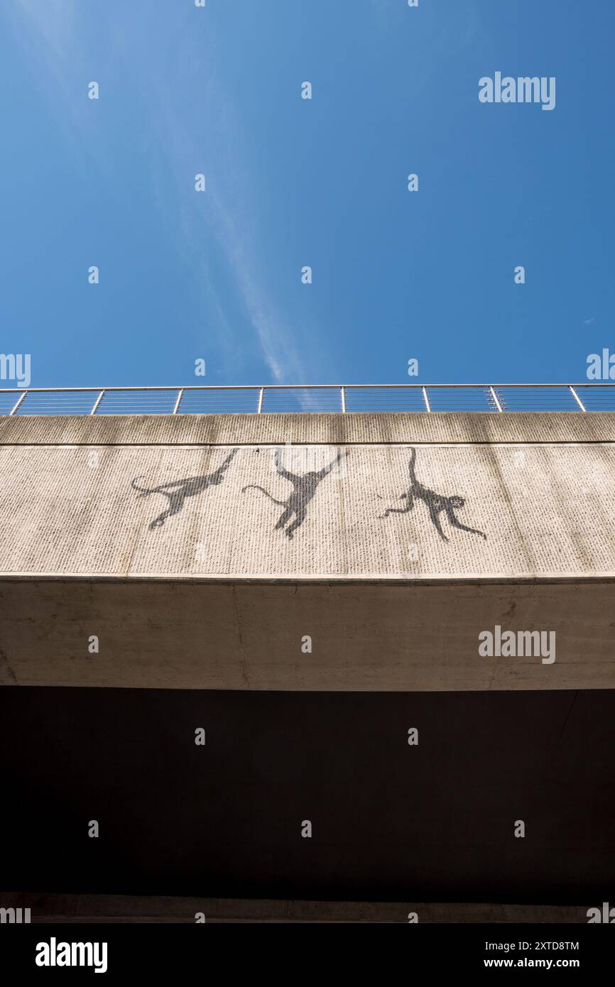 Banksy three swinging monkeys on railway bridge Brick Lane in ...