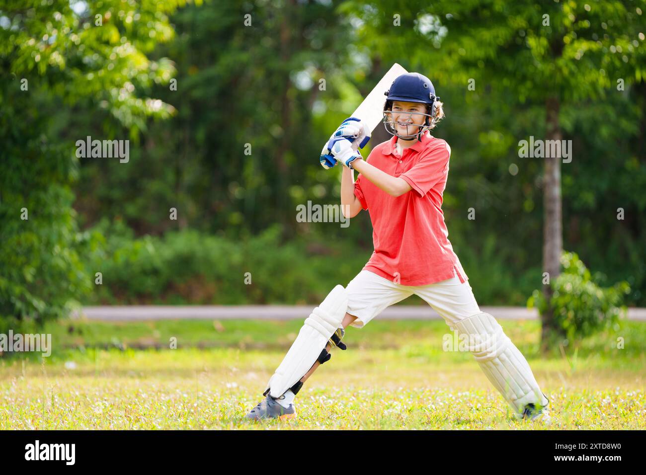 Children playing cricket in park hi-res stock photography and images ...