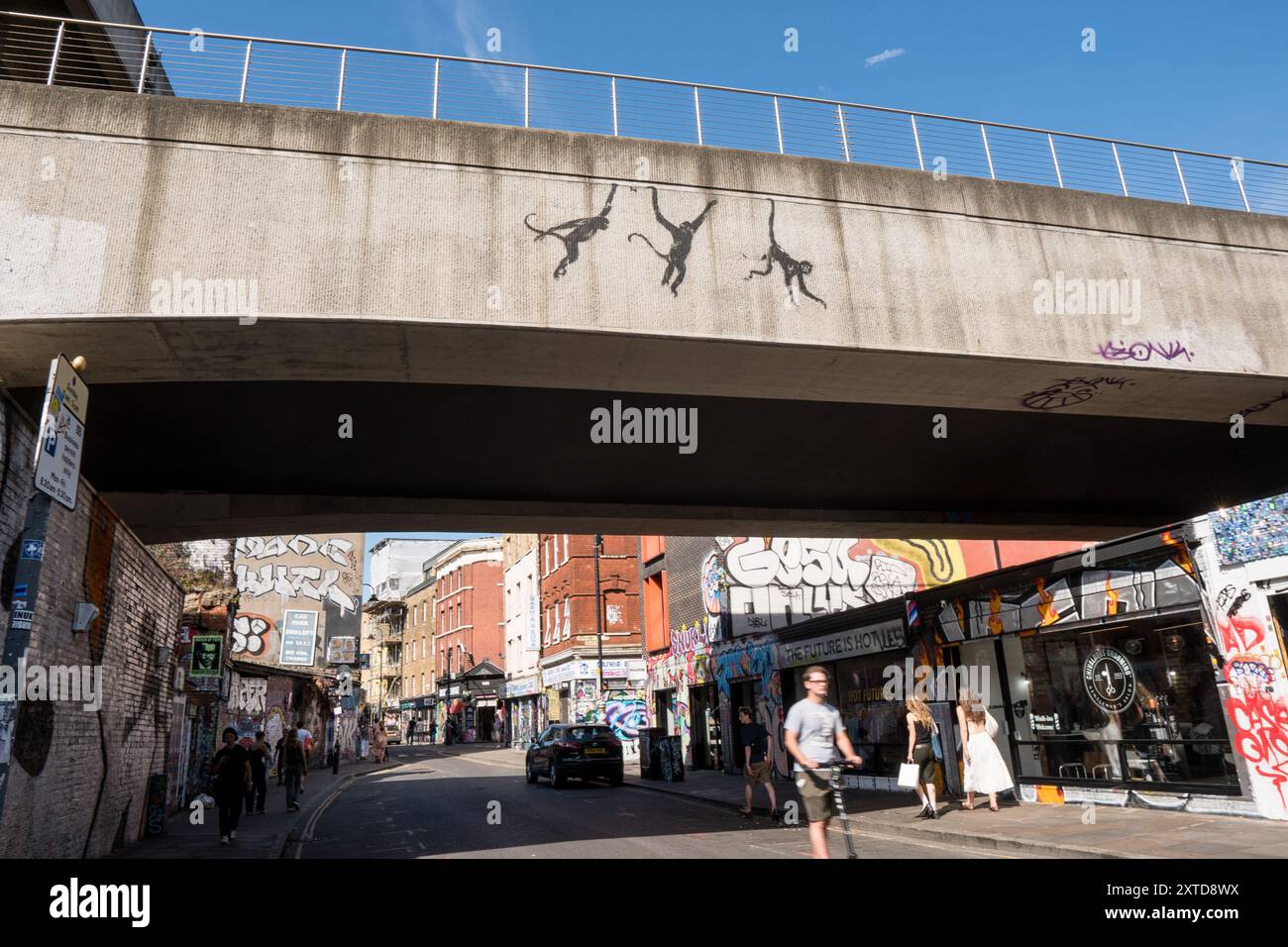 Banksy three swinging monkeys on railway bridge Brick Lane in ...