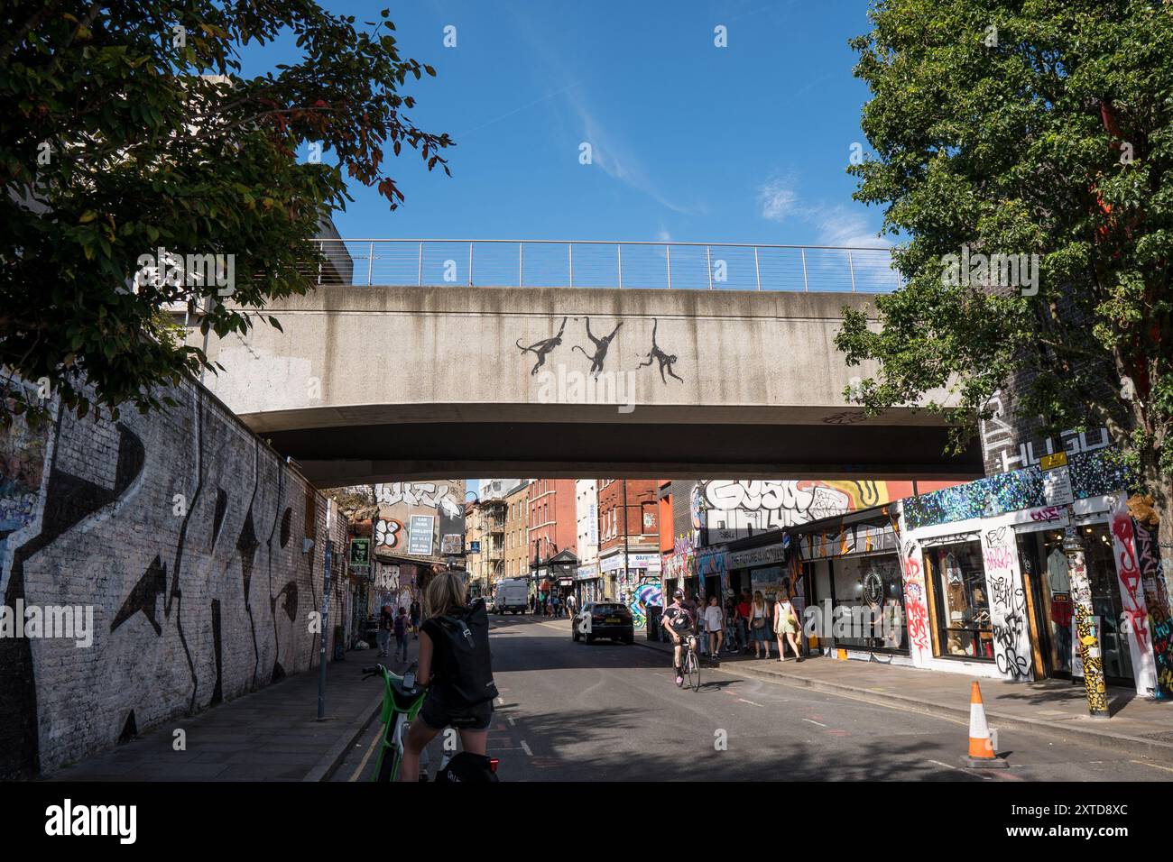 Banksy three swinging monkeys on railway bridge Brick Lane in ...