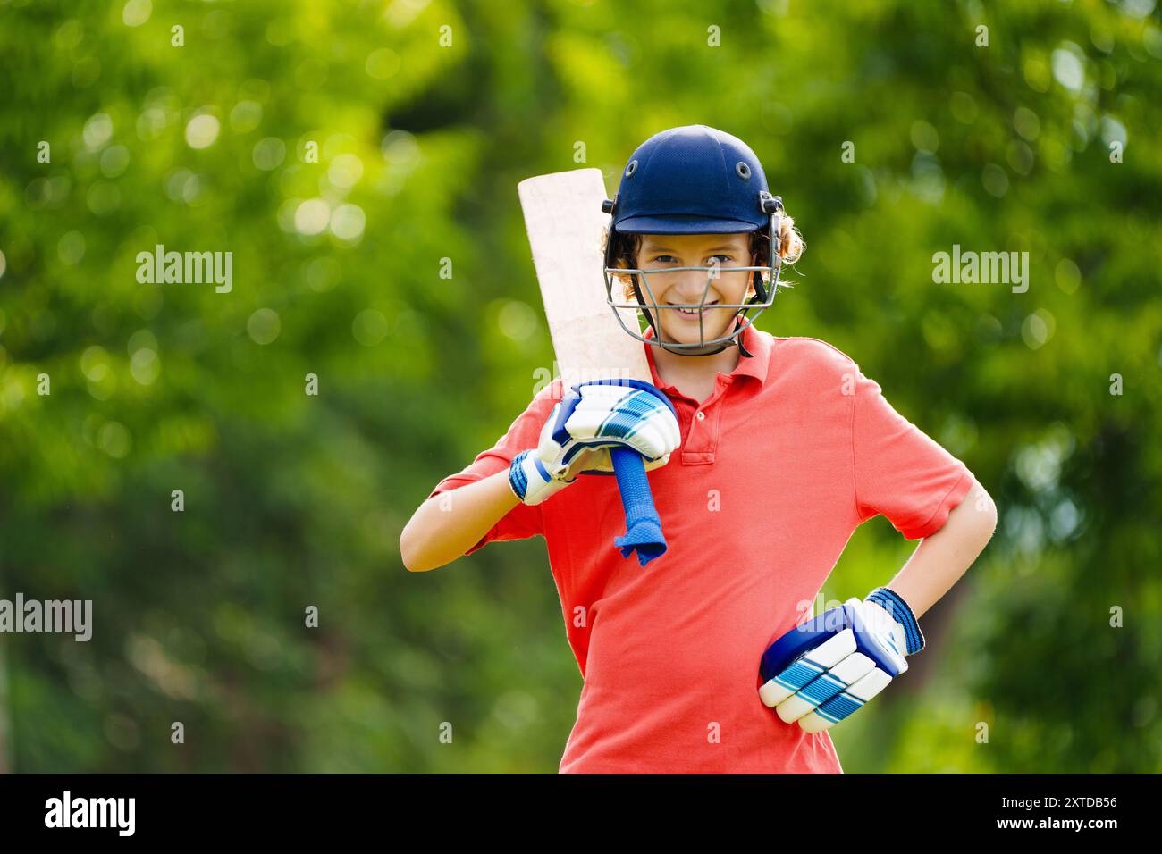 Kids playing cricket in summer park. Boy with bat and ball on cricket ...