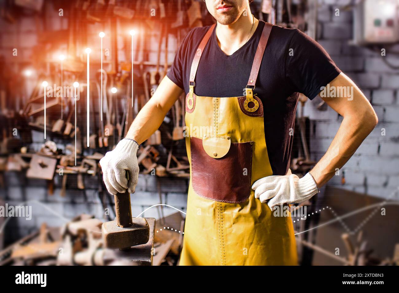 A man in a black shirt and yellow apron stands in front of a wall of ...