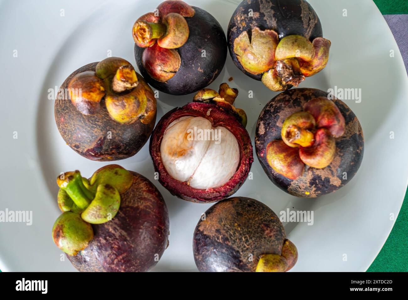 A bowl of mangosteen fruit, a seasonal, exotic fruit found in tropical ...