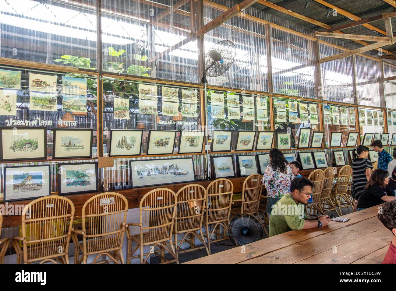 Watercolour paintings on display and on sale at a quiet wing of the The Hin Bus Depot in George ...