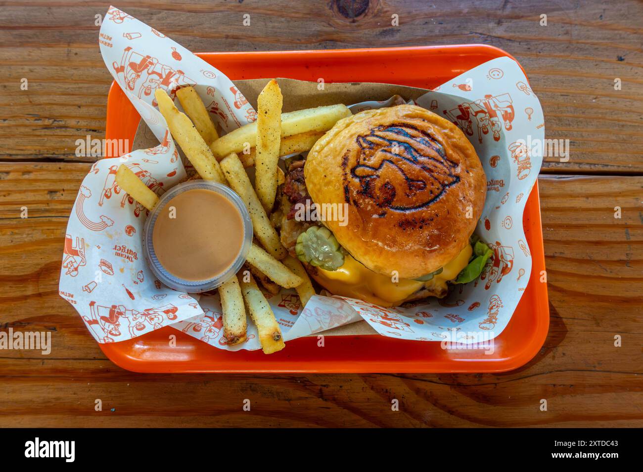 Cheeseburger and chips on a tray for lunch from a restaurant at a food ...