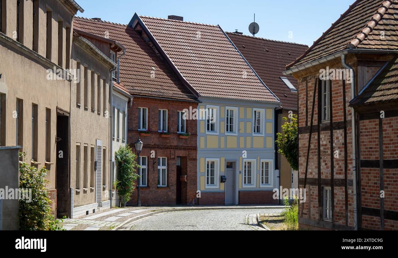 12 August 2024, Brandenburg, Wittstock/Dosse: View of a street with old ...