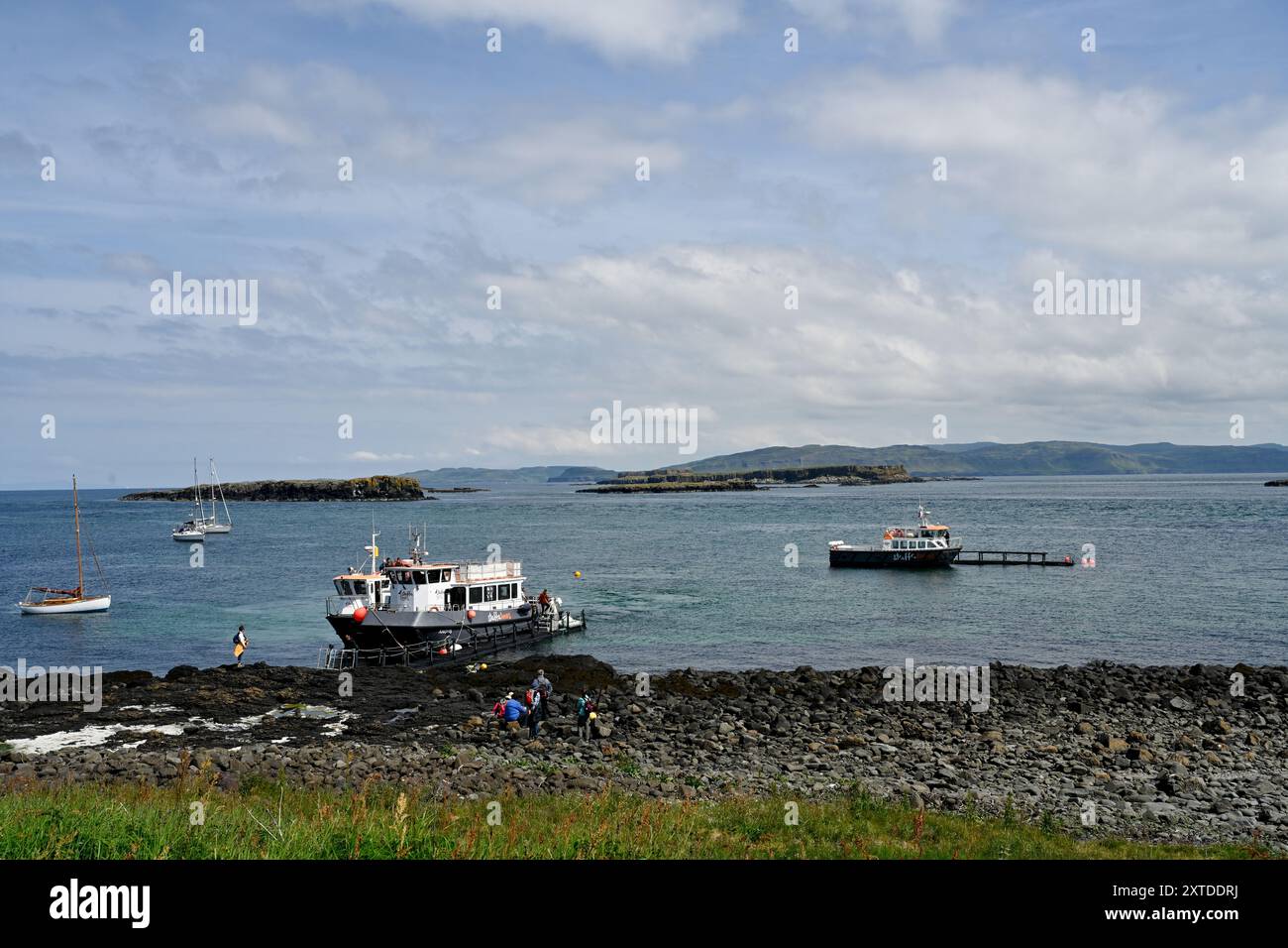 Lunga, Treshnish Isles. Tour boats landing on the islands to see the ...