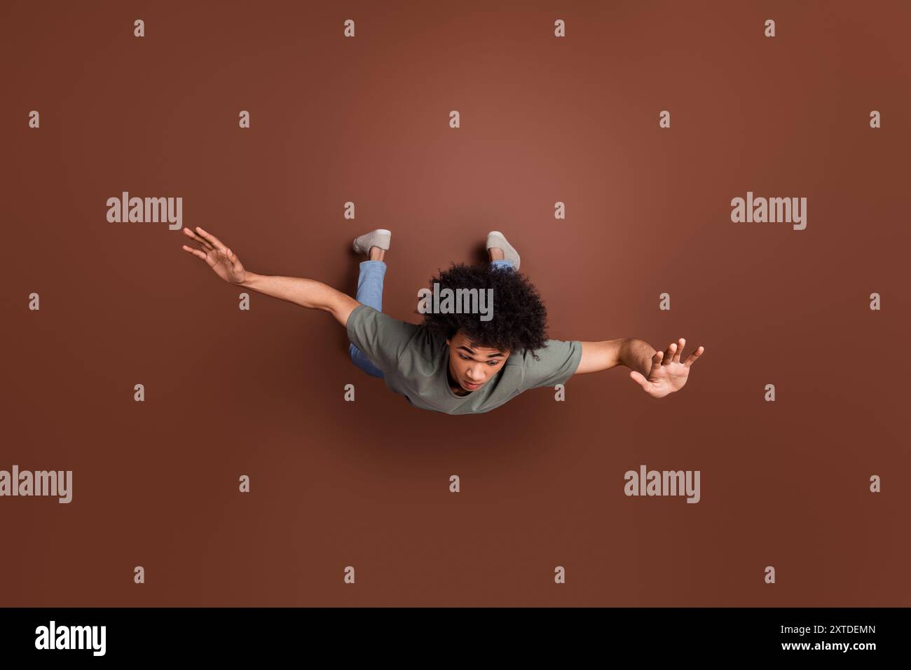 Full body photo of attractive young man falling down scared dressed ...