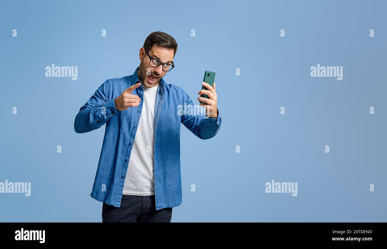 businessman screaming into smart phone over white background Stock ...