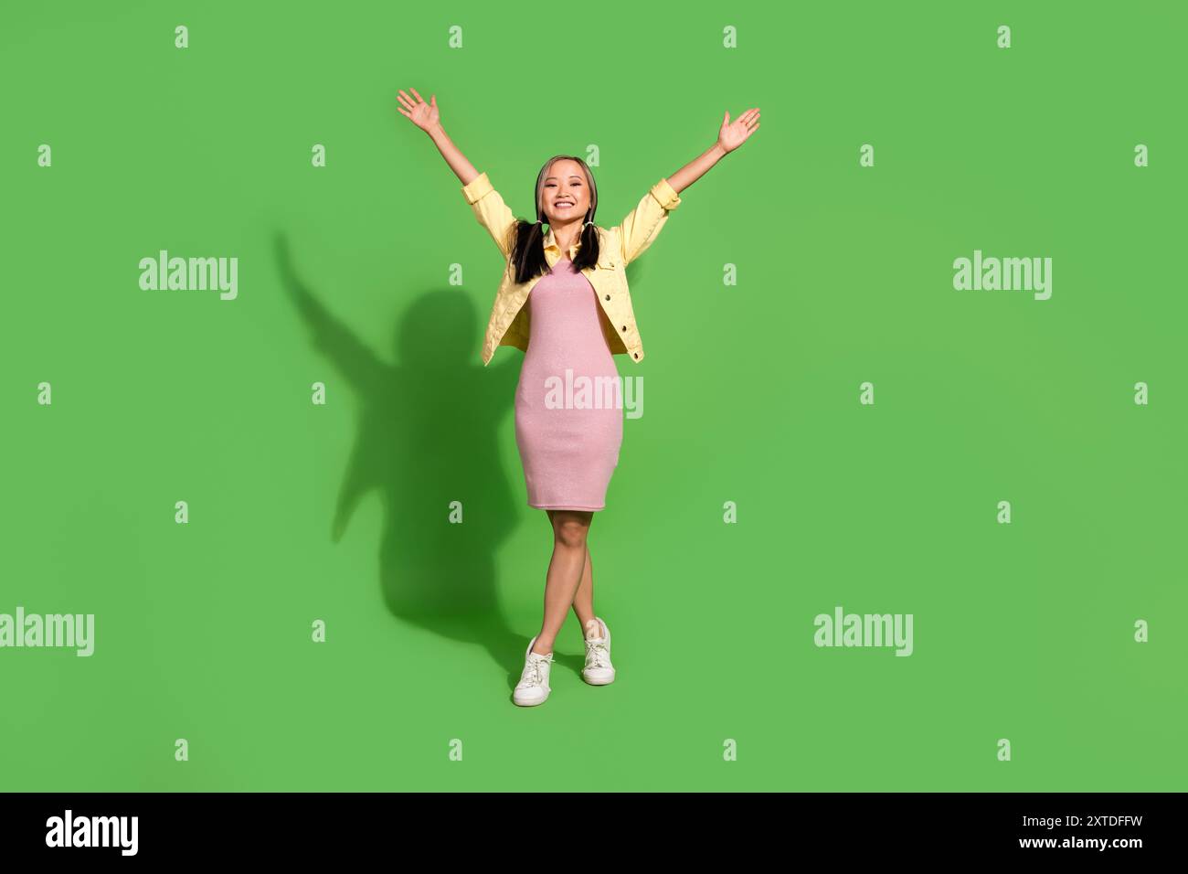 Full size photo of nice young girl raise arms wear jacket dress ...
