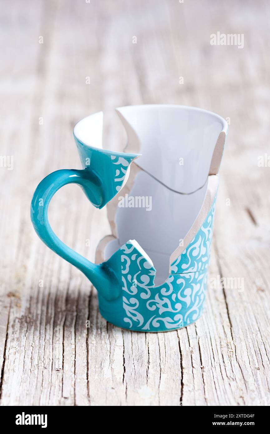 porcelain cup broken into pieces and stuck again Stock Photo - Alamy