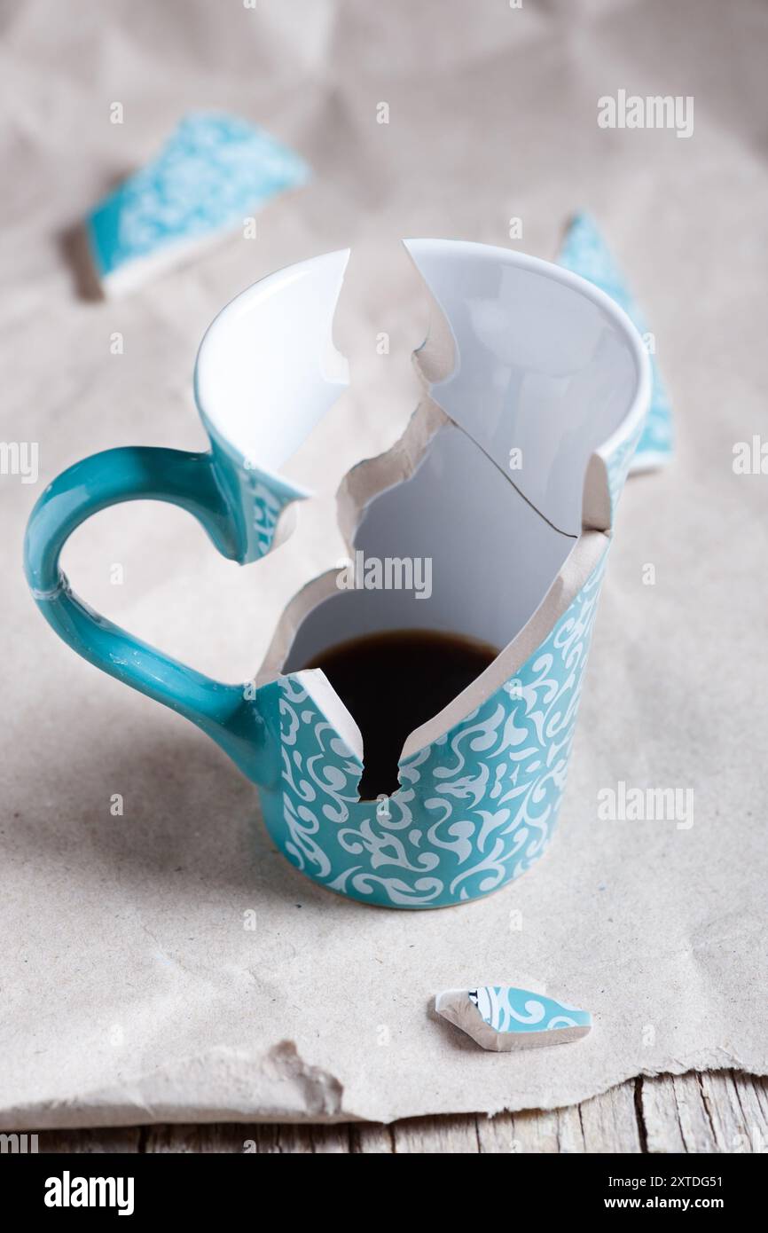 porcelain cup broken into pieces and stuck again Stock Photo - Alamy