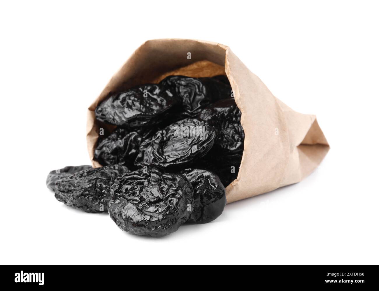 Paper bag with tasty dried plums (prunes) isolated on white Stock Photo ...