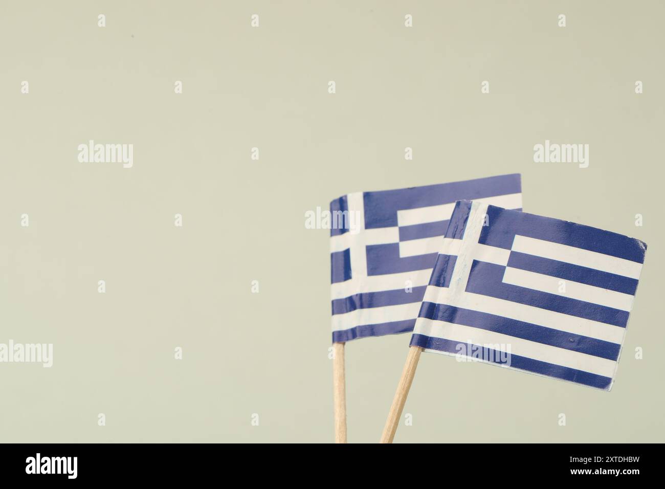 Small paper flags of Greece on light background, space for text Stock ...
