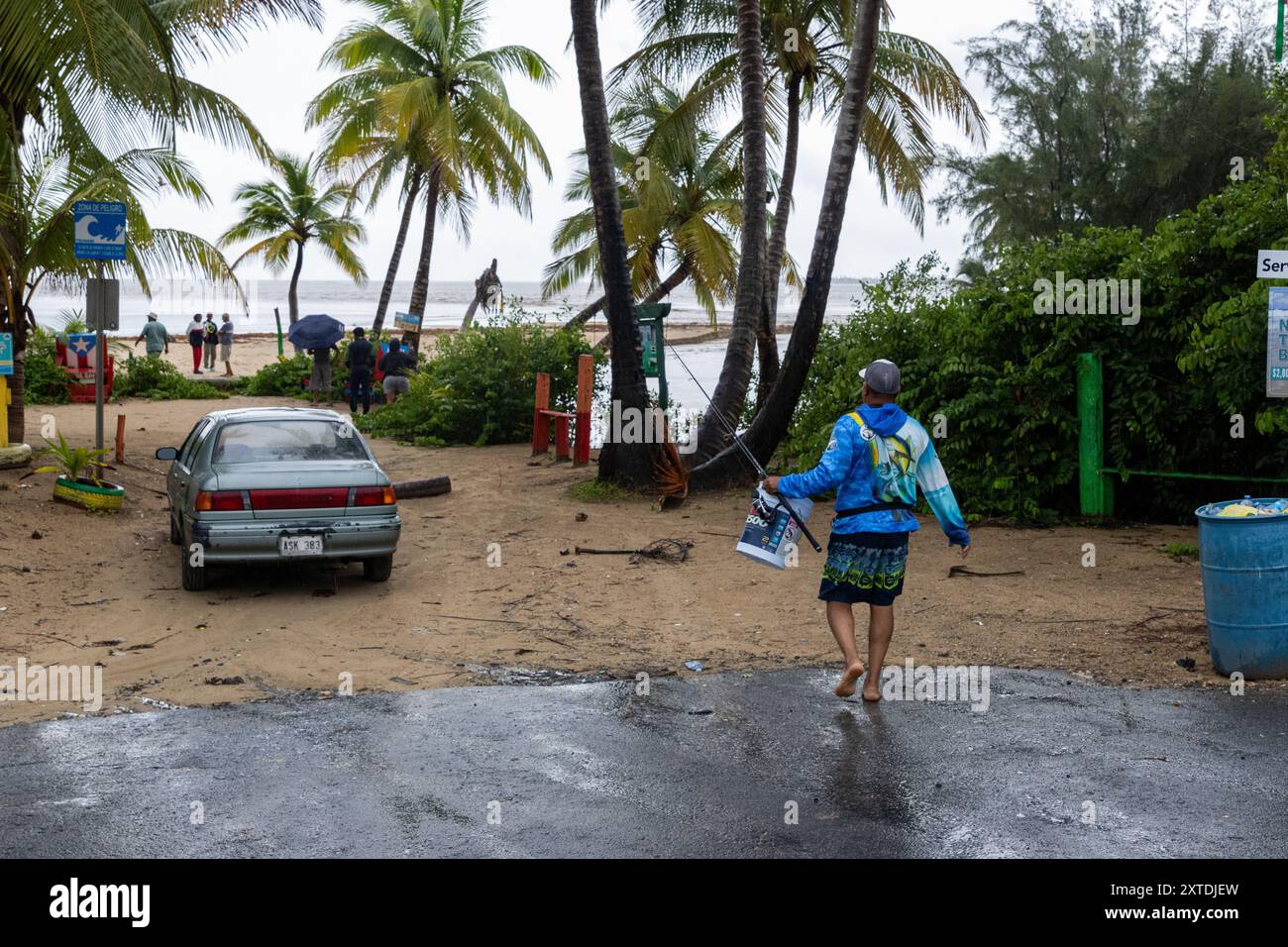 Puerto Ricans fish amid the flooding caused by Tropical Storm Ernesto ...