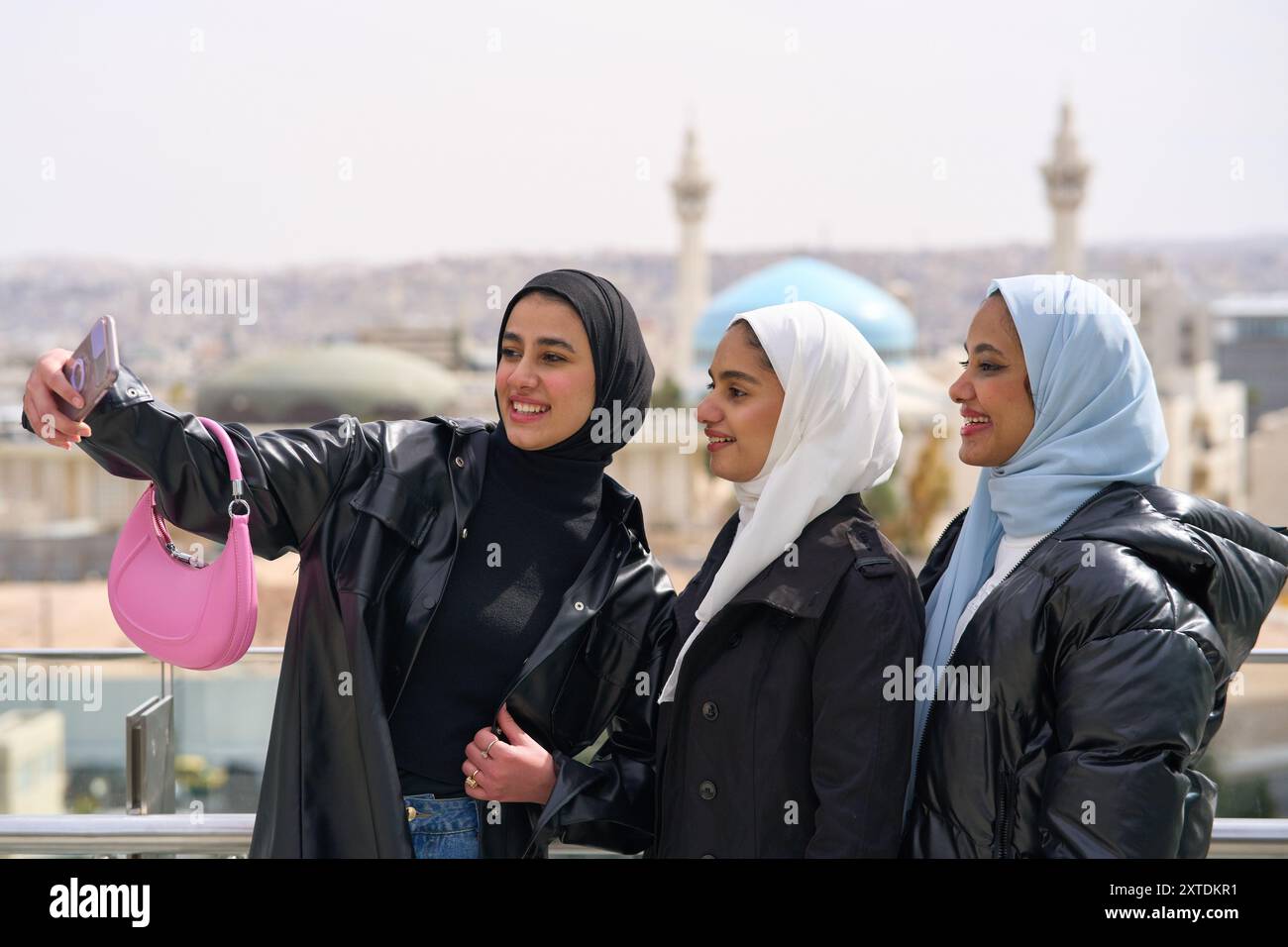 Three cheerful muslim women hi-res stock photography and images - Alamy