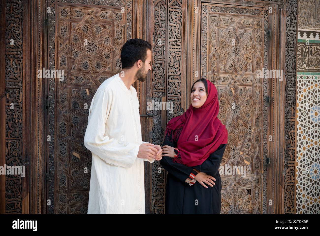 Young Muslim couple in relationship talking and smiling Stock Photo - Alamy
