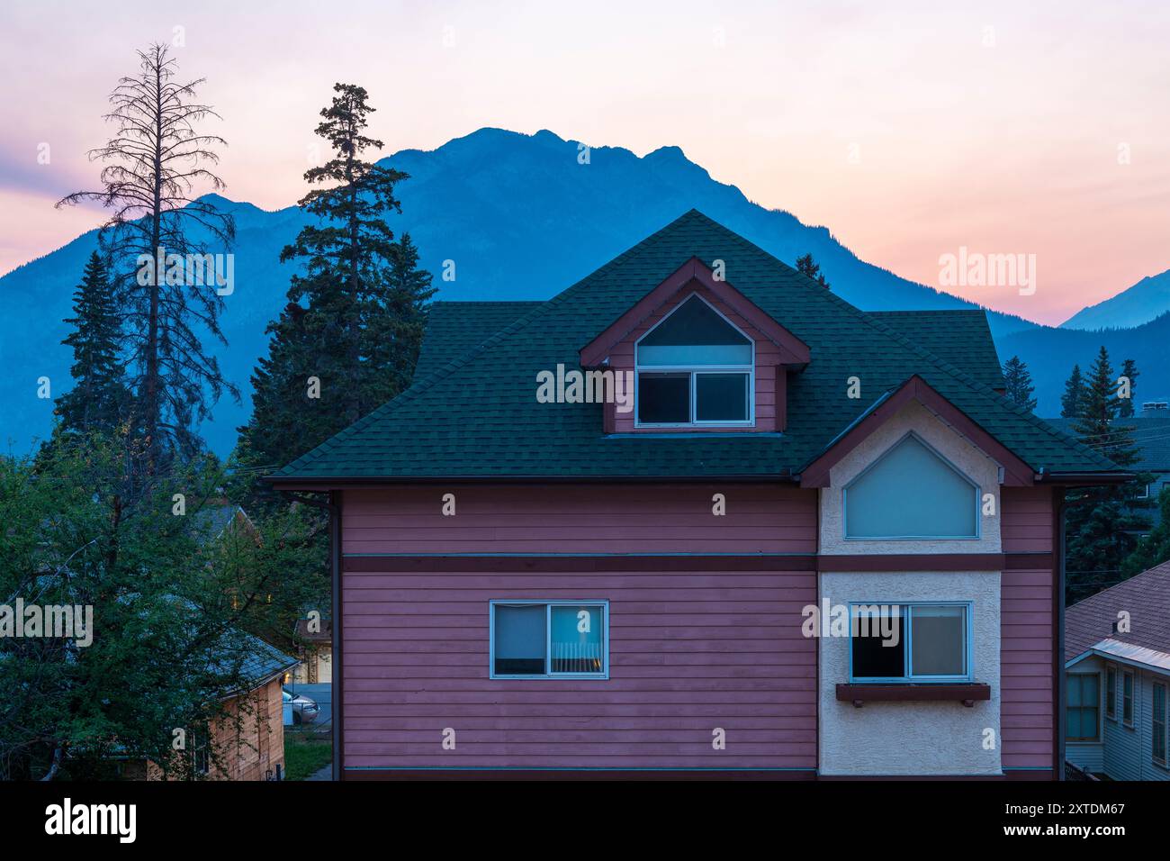 Traditional wooden bungalow architecture in Banff town at sunset, Banff ...