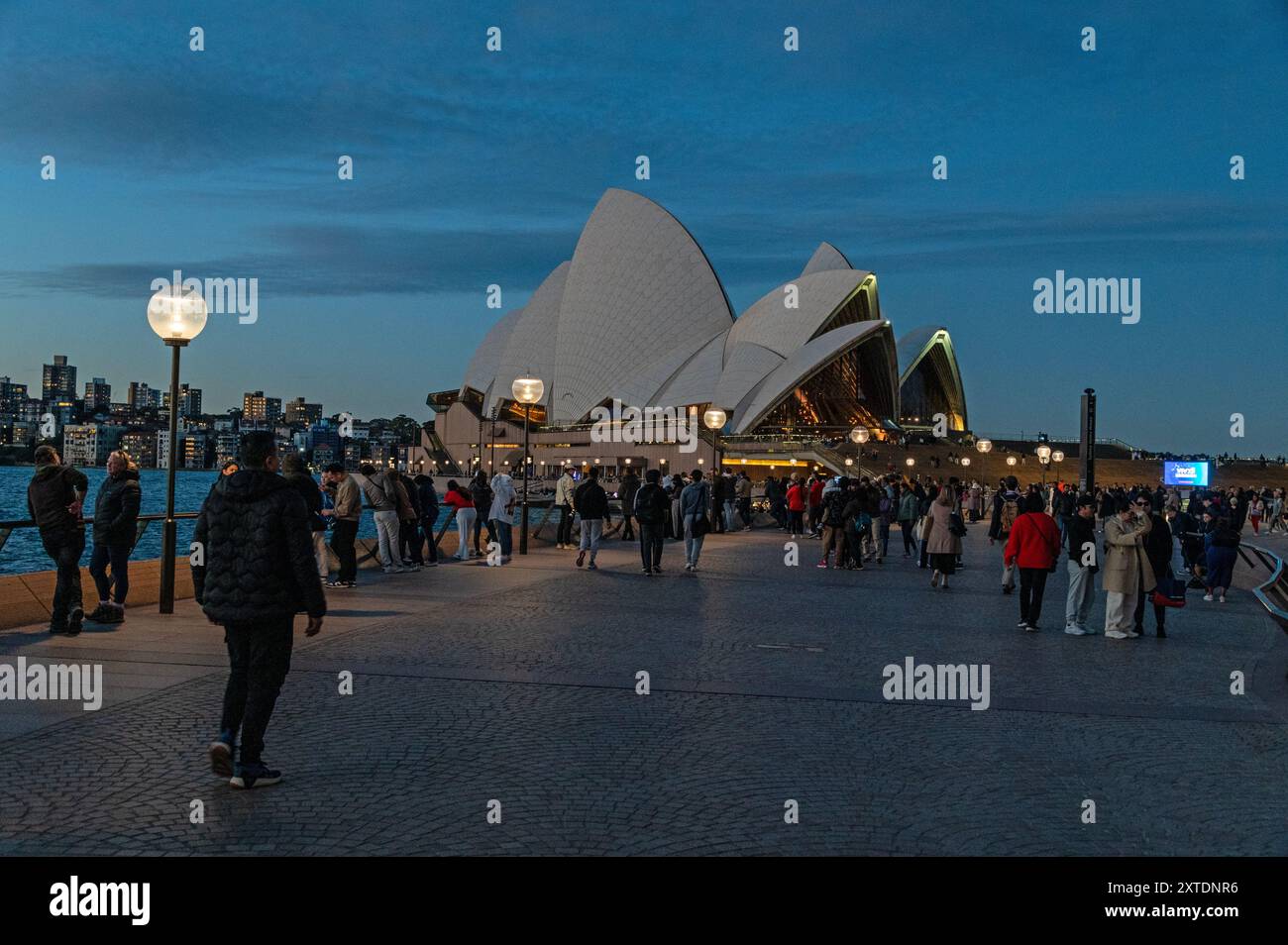 The Opera House on Circular Quay is the low autumn sun setting in ...