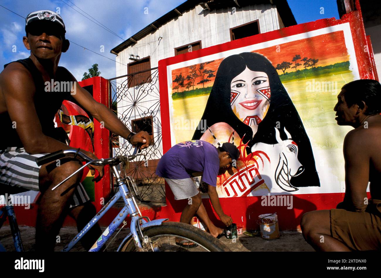 A man paint a wall mural of the "Cunha Poranga", the queen of the "Boi ...