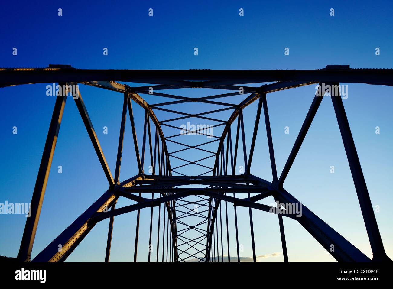 The steel girder structure of the old Omsund Bridge against the blue ...