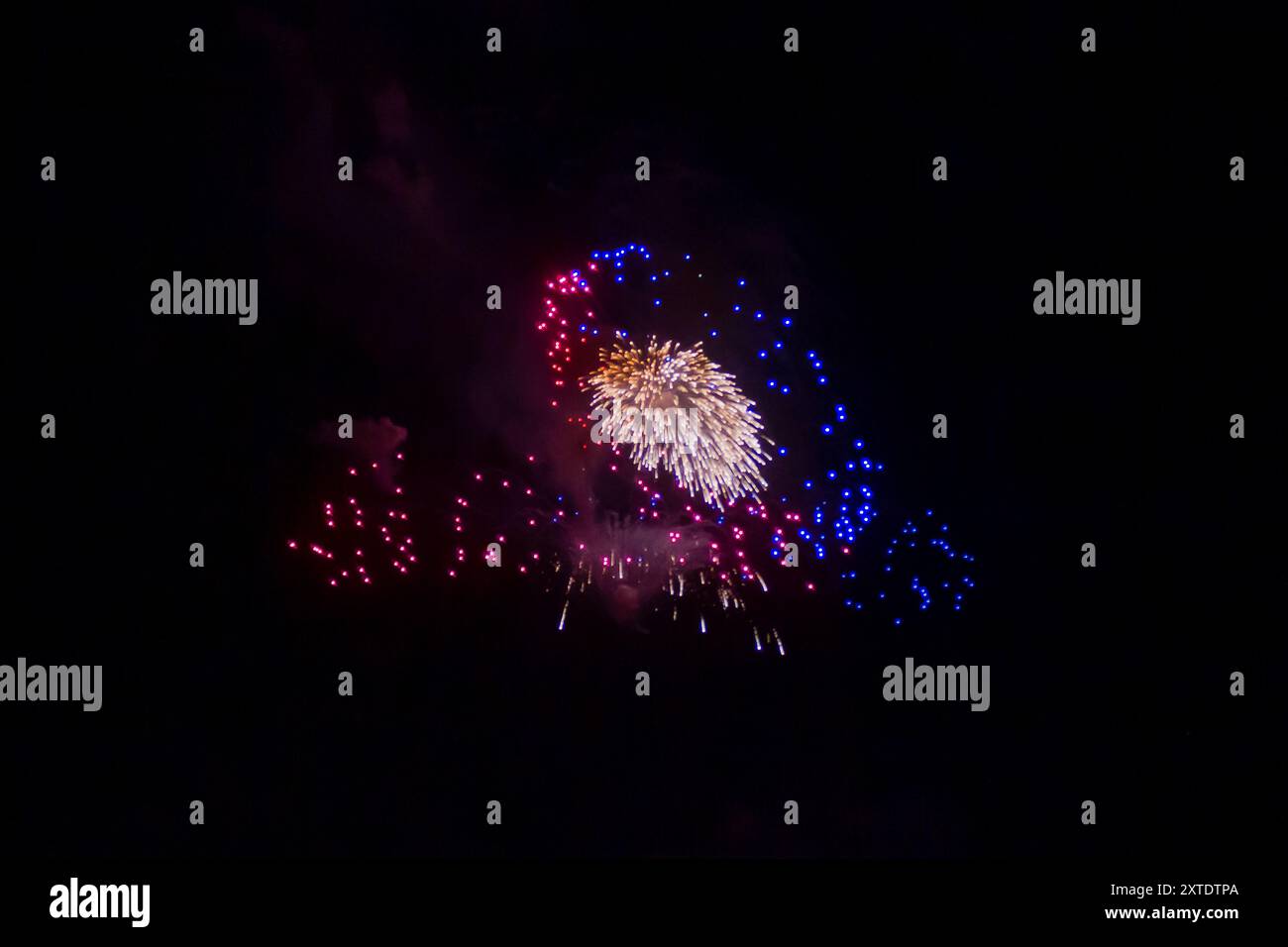 Vibrant fireworks illuminate the night sky in explosive celebration ...