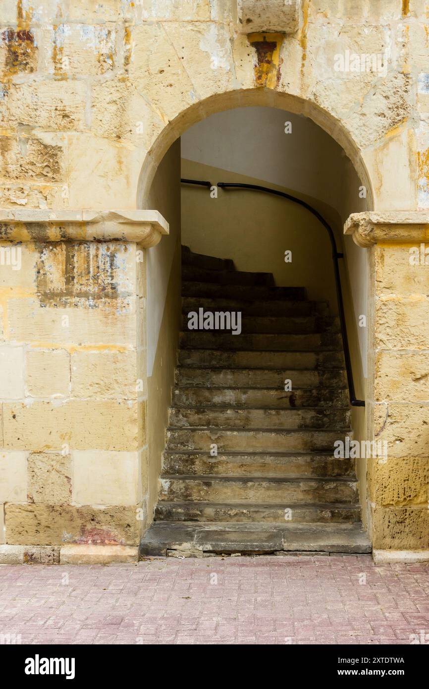 an old stone arch with a staircase taken at Cospicua, Malta Stock Photo ...