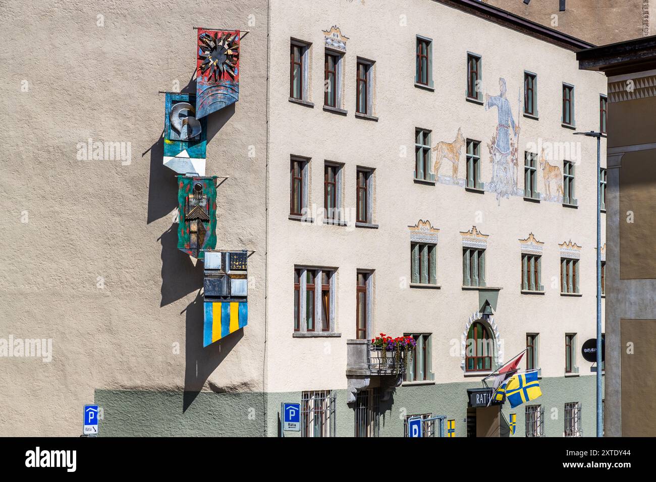 The façade of Davos town hall is decorated with four banners by Herman ...