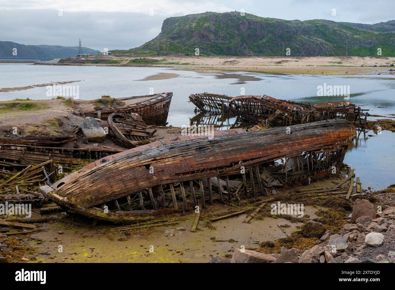 The hull of the old ship in the cemetery of old ships on a cloudy July ...