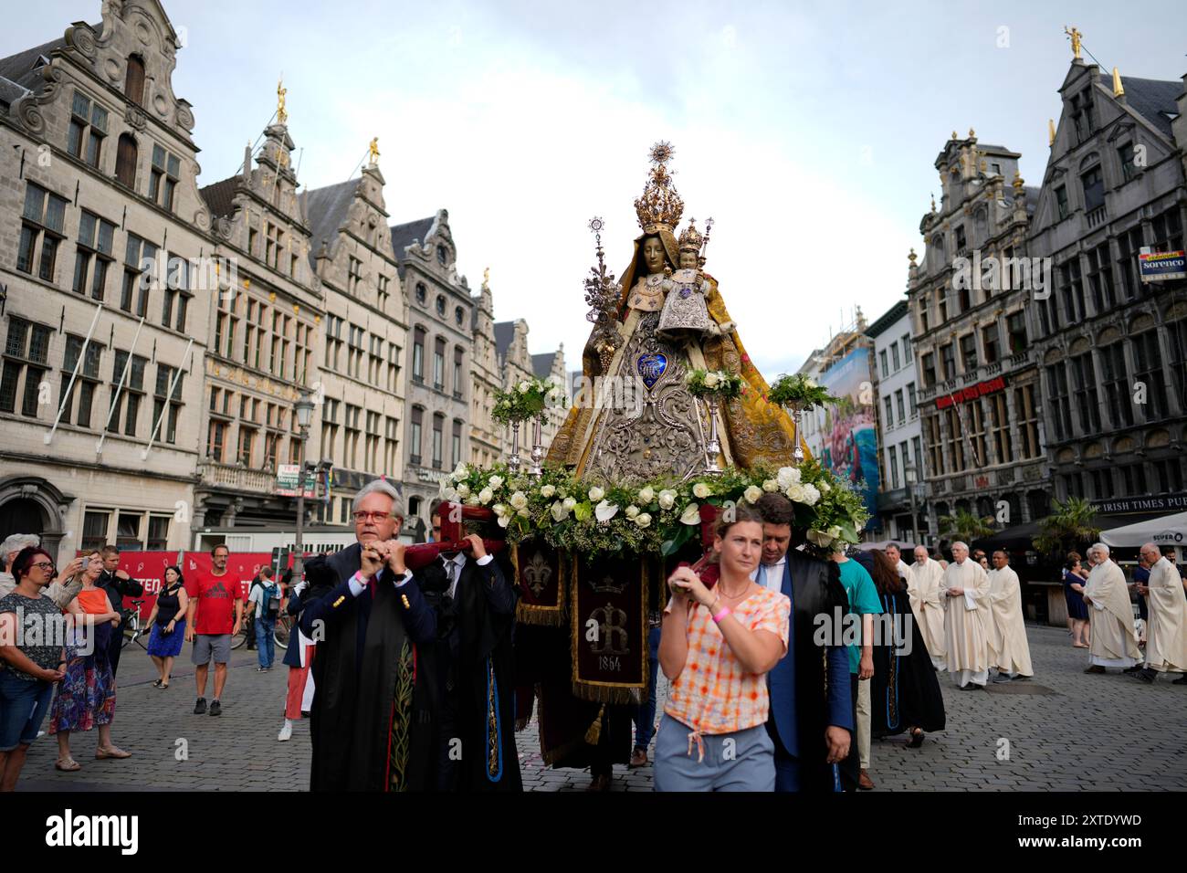 Bearers walk together as they carry a float during the Assumption of ...