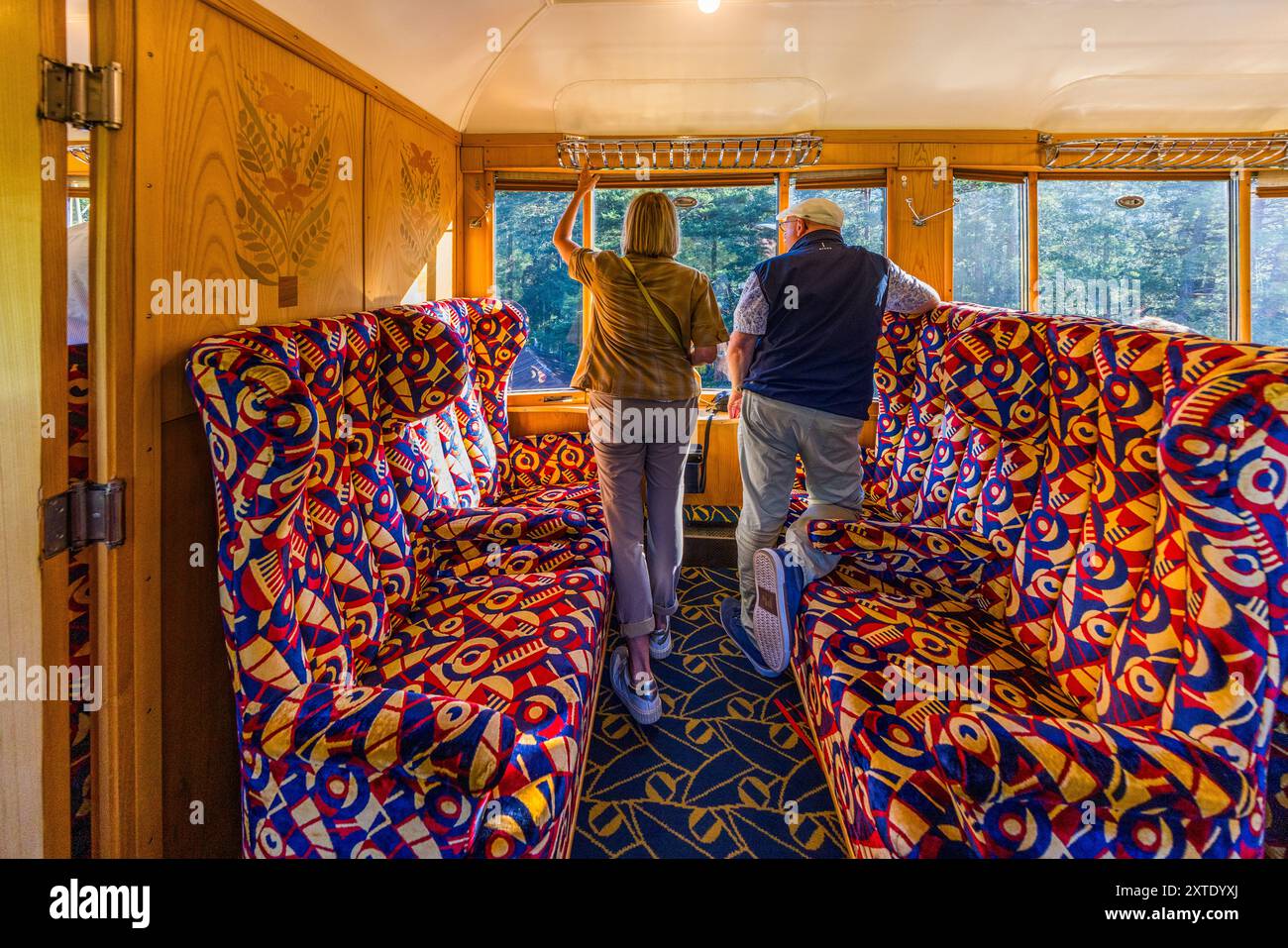 Passengers look out of the window of the Alpine Classic Pullman Express ...