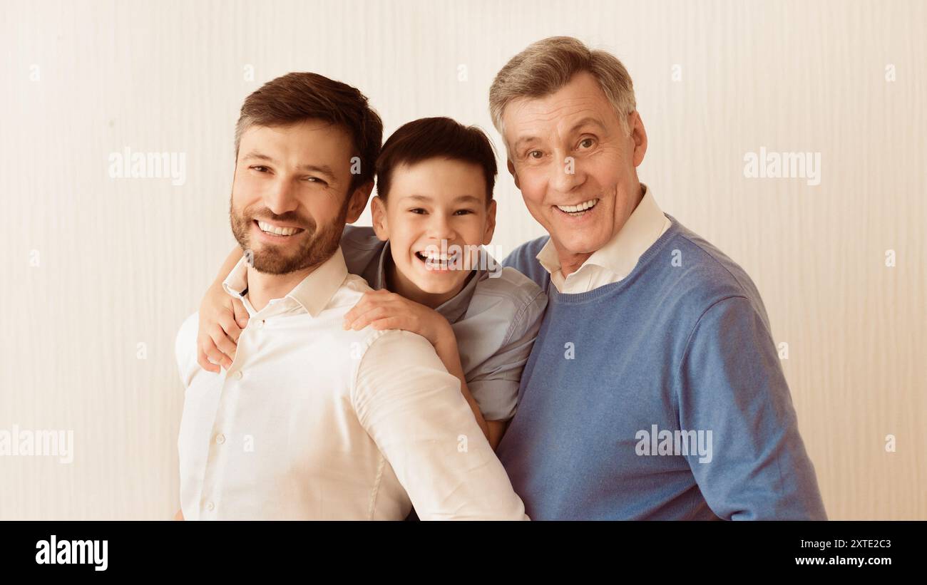 Smiling Boy, Father And Grandfather Hugging Standing Against White ...