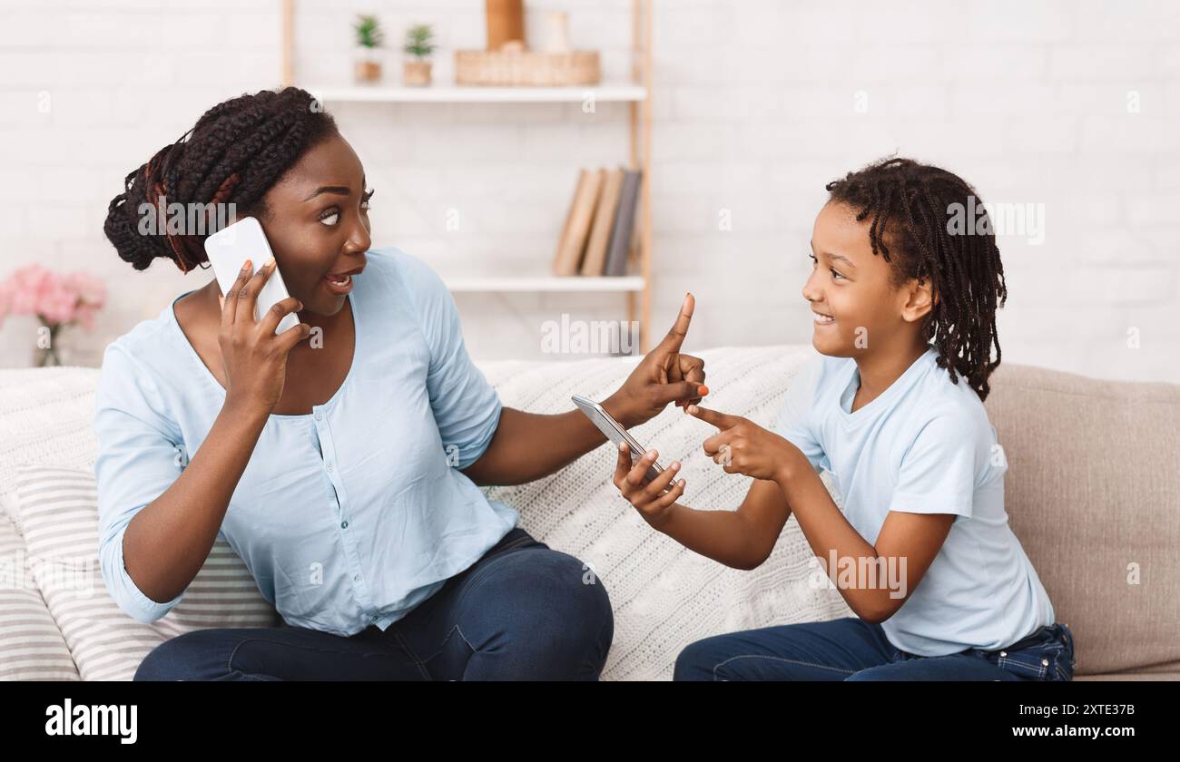African american family using iPhone 11 pro max Stock Photo - Alamy
