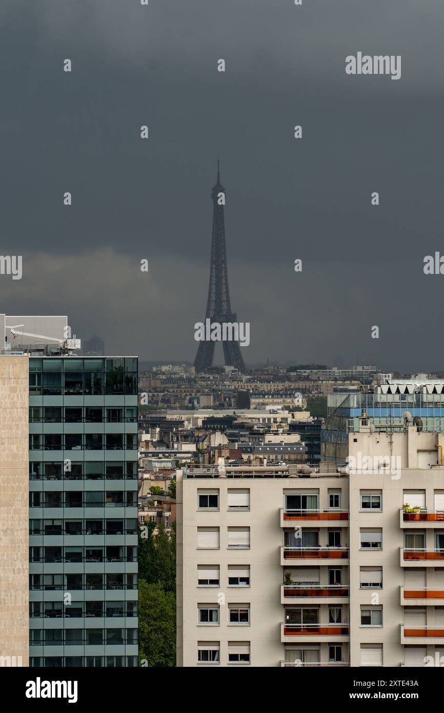 Distant view of Eiffel Tower in storm rainy weather with downpour Paris ...
