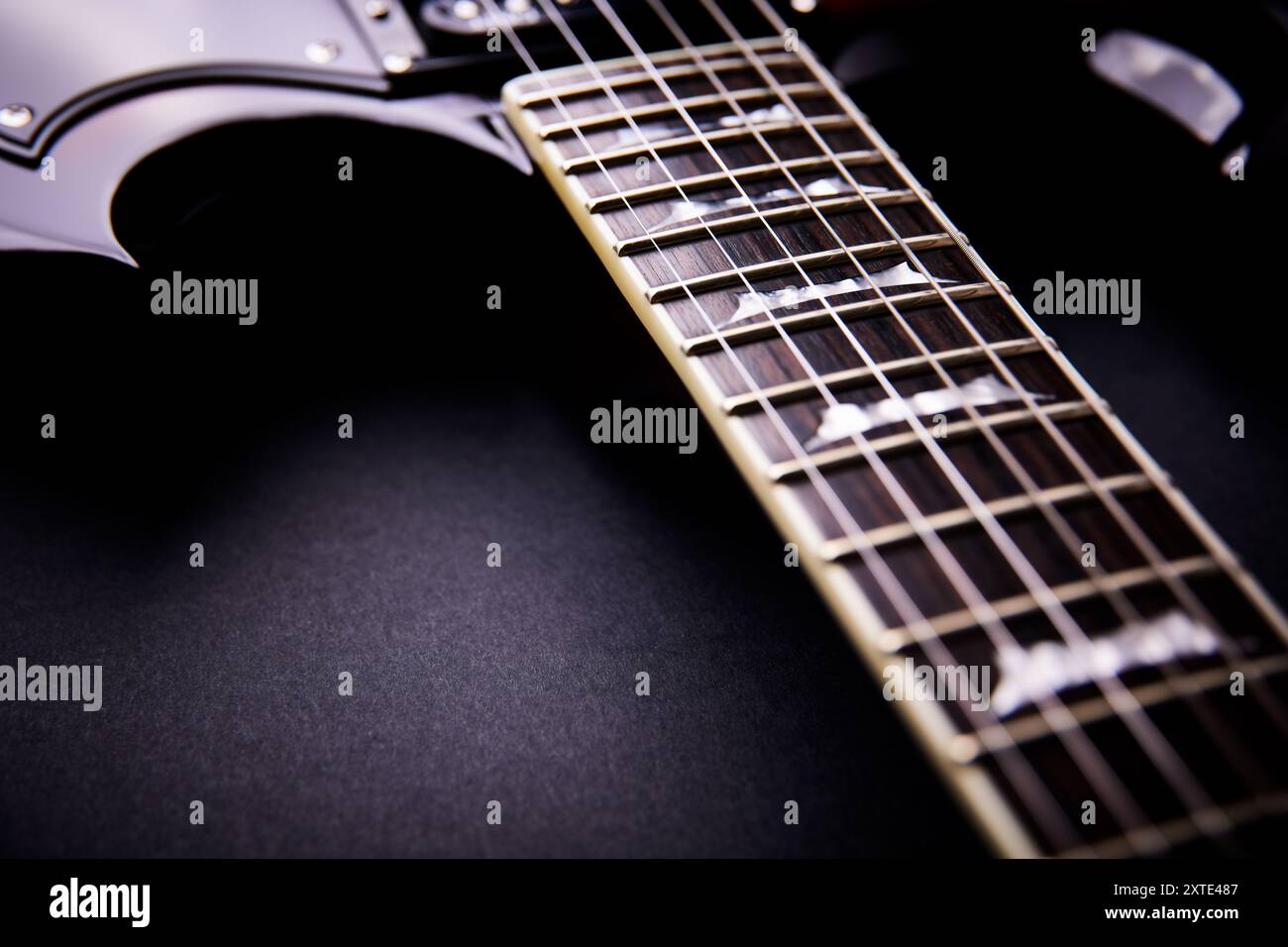Fretboard of modern electric guitar. Close up Stock Photo - Alamy